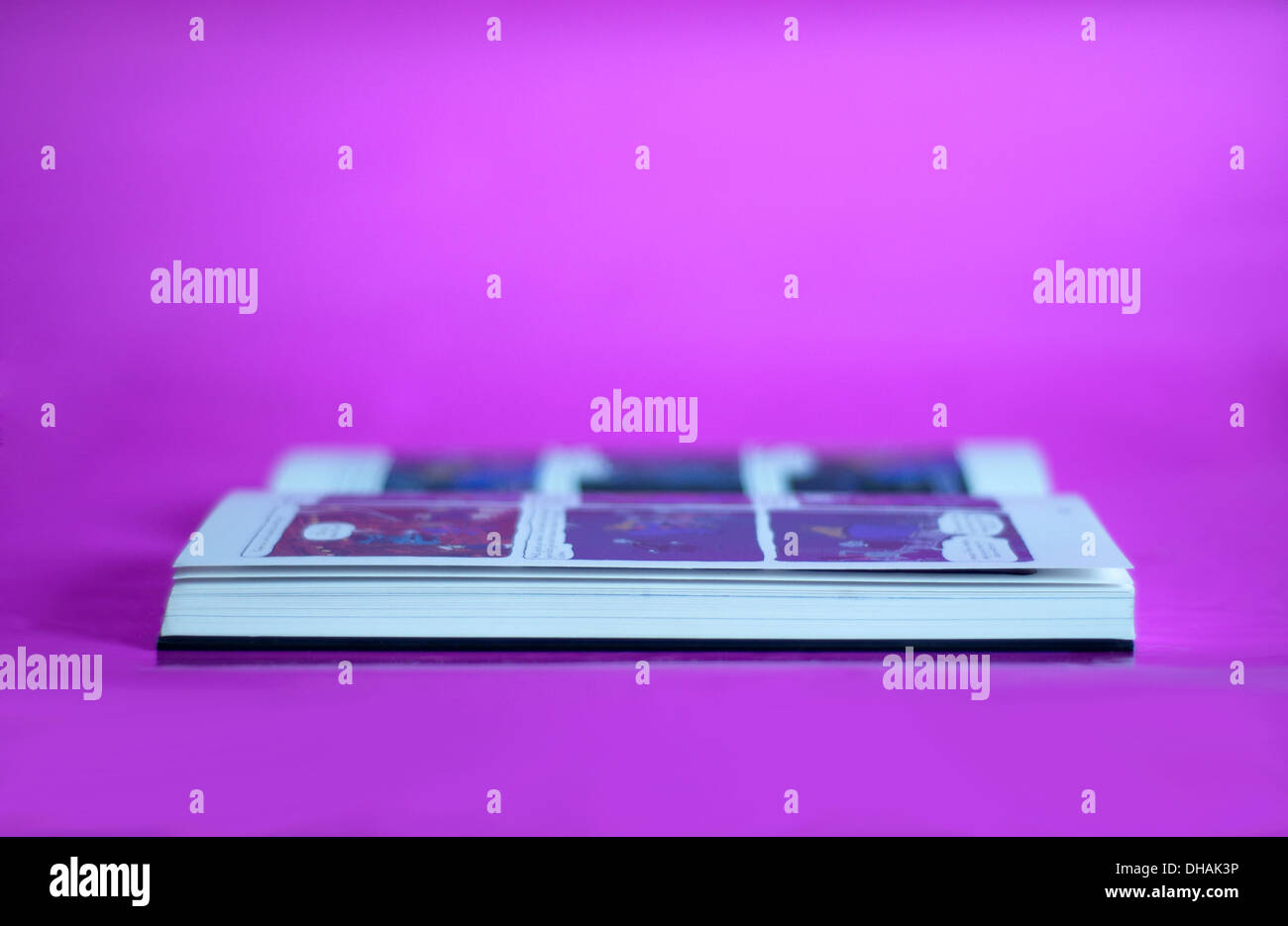 A comic book showing page edges with illustrations obscured Stock Photo ...