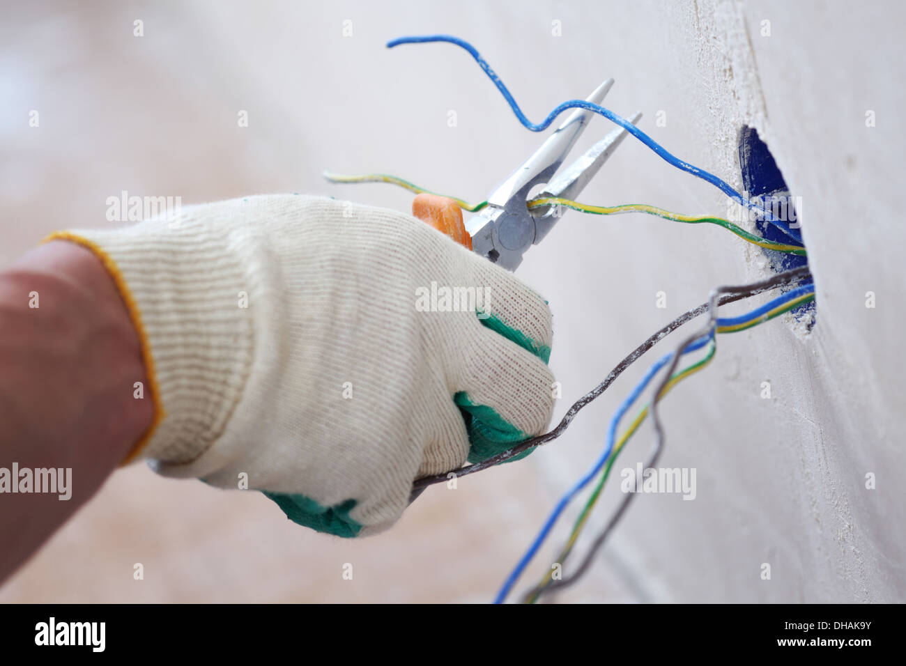 worker puts the wires in the wall Stock Photo - Alamy