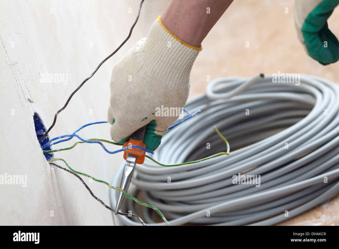 worker puts the wires in the wall Stock Photo - Alamy