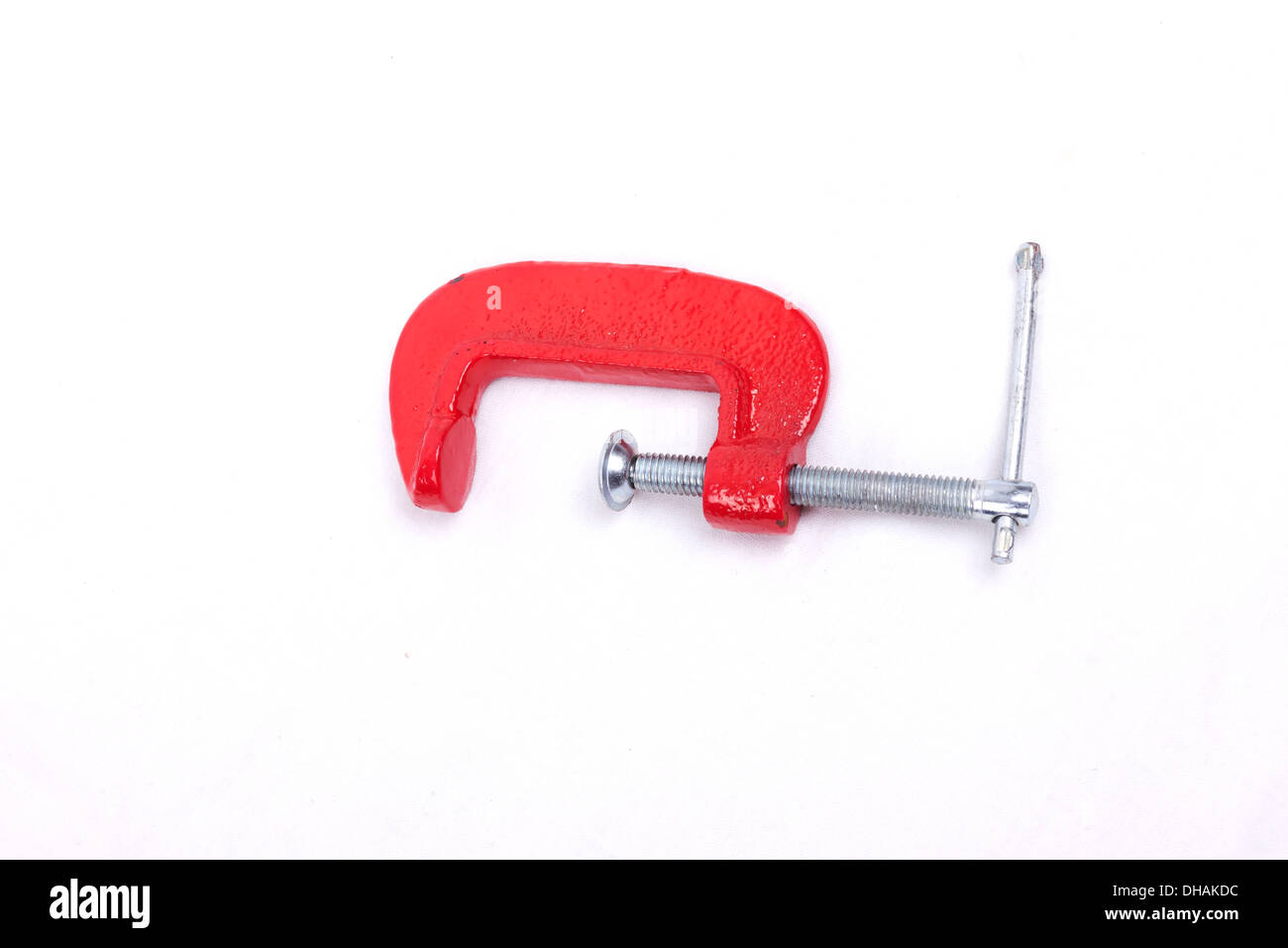 Red clamp isolated on a white background Stock Photo - Alamy