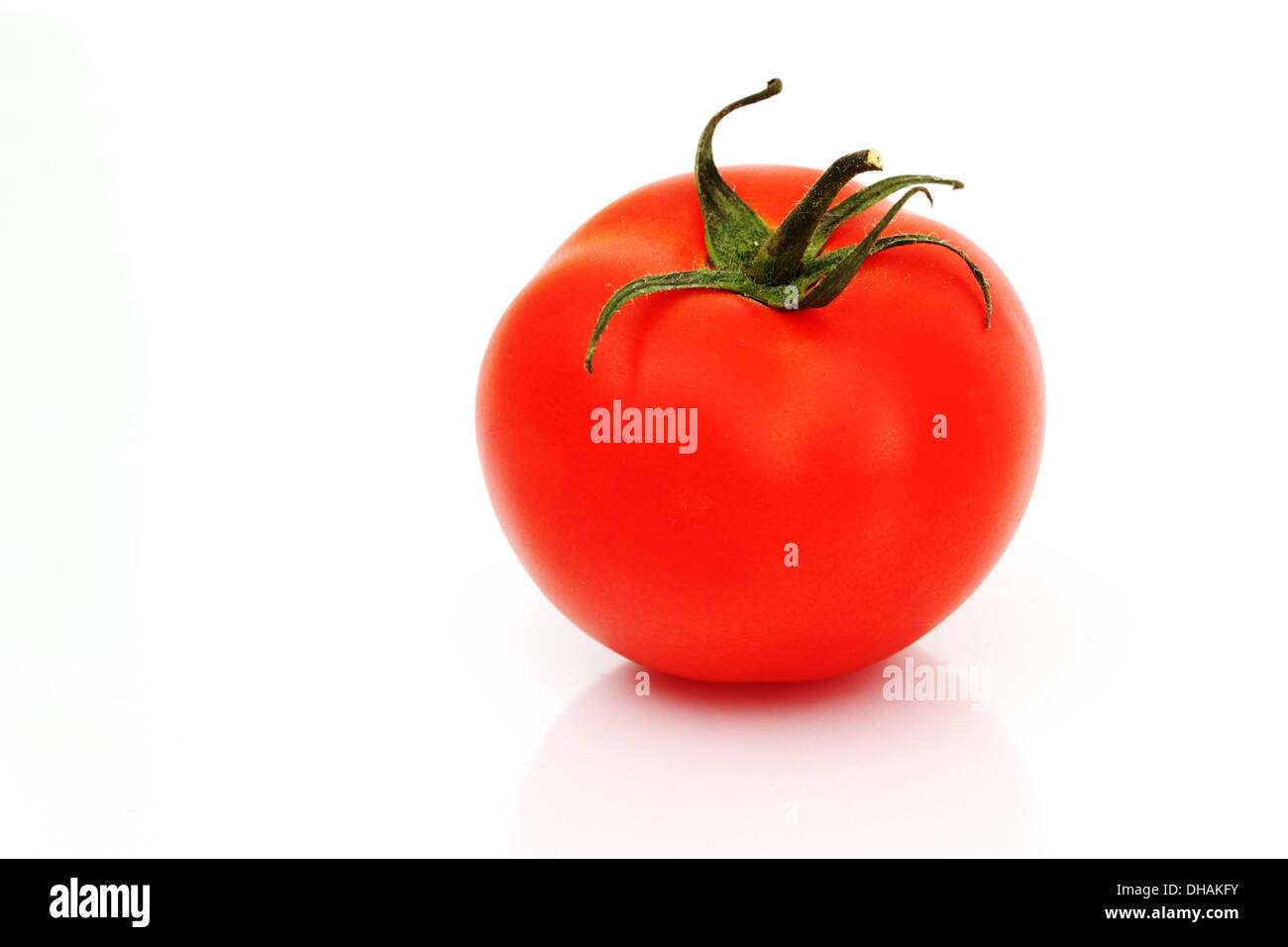 one tomato isolated on white Stock Photo - Alamy