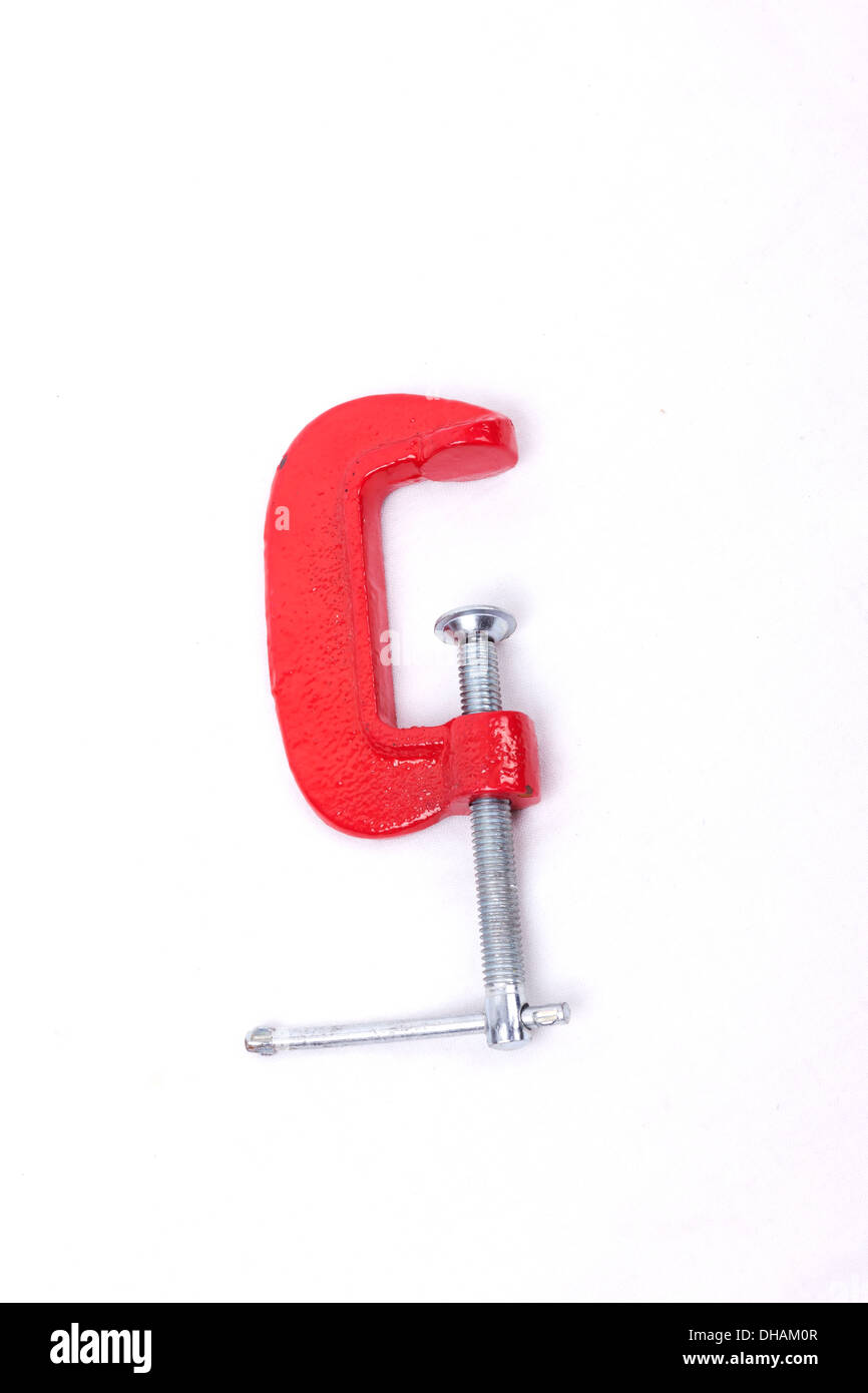 Red clamp isolated on a white background Stock Photo - Alamy