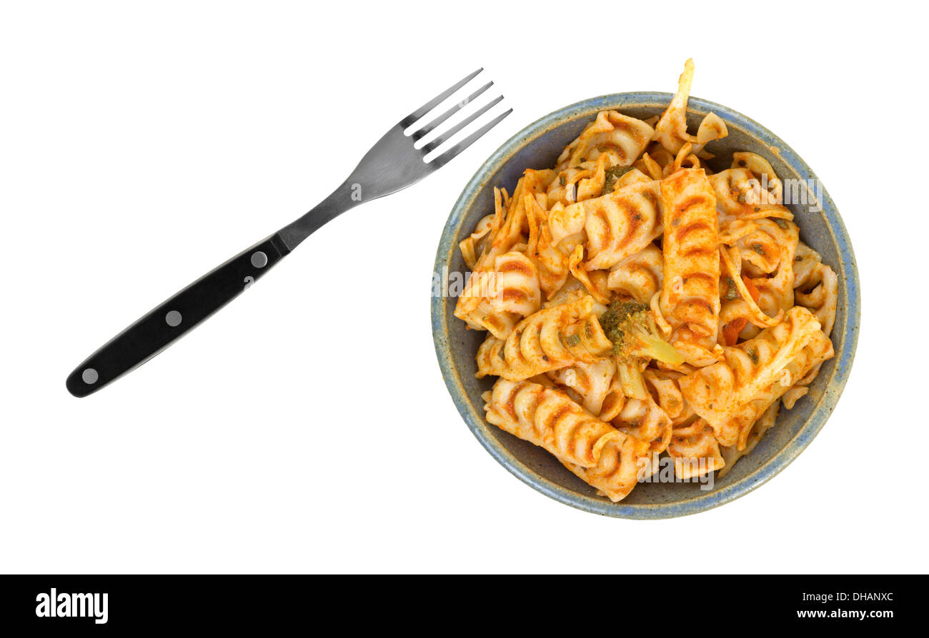 Top view of a bowl filled with meatless chop suey with a fork to the ...