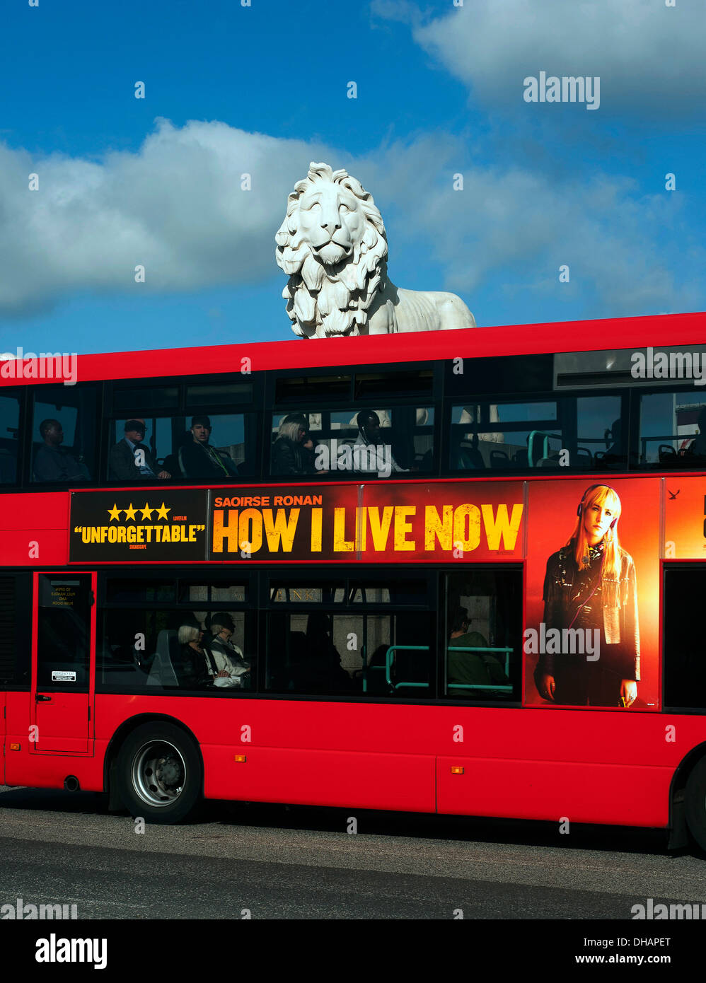 The South Bank Lion on Westminster Bridge looks out over London bus ...