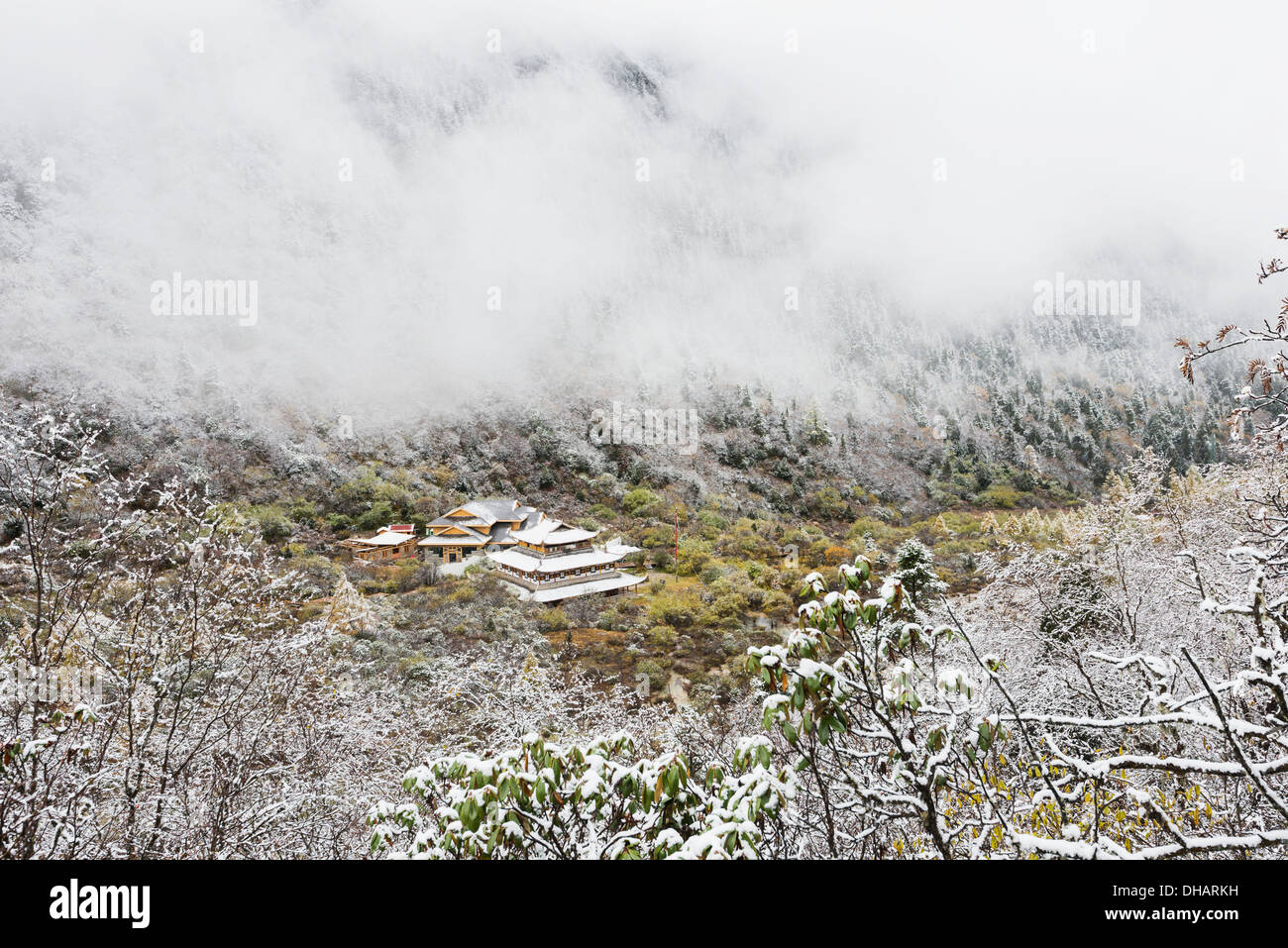 An Ancient Tibetan Buddhist Temple Between Two Snowy Mountain Slopes In ...