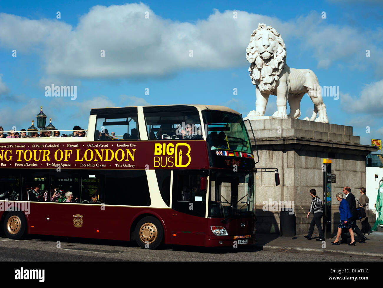 The South Bank Lion on Westminster Bridge looks out over tourist buses ...