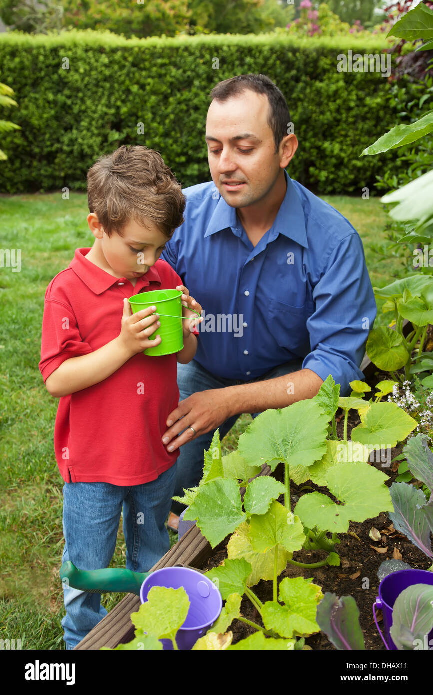 A Father With His Young Son Working In Their Garden; Pacifica ...