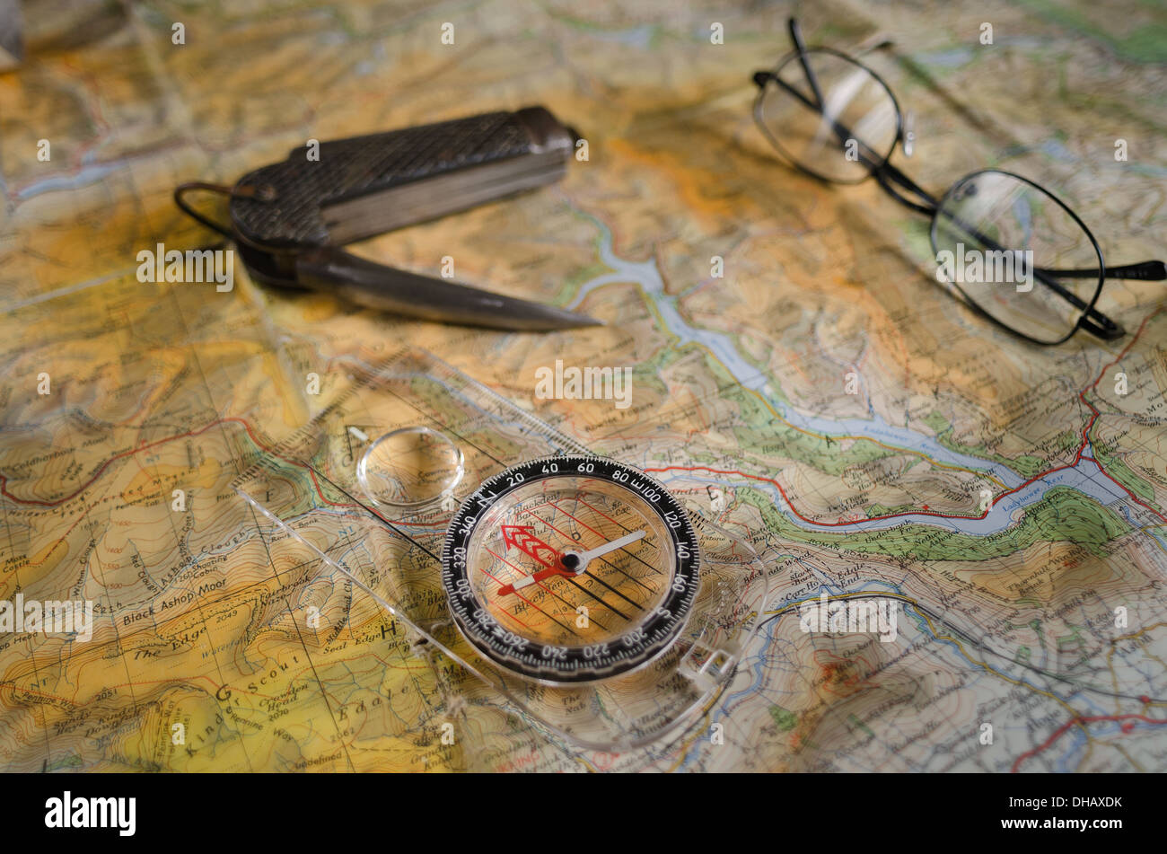classic compass on colorful map preparing for journey with lots of ...