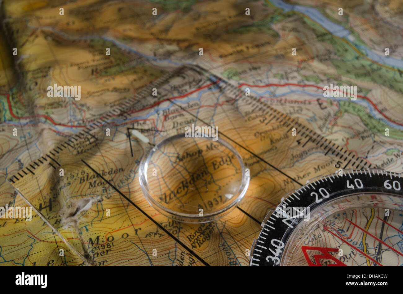 classic compass on colorful map preparing for journey with lots of ...