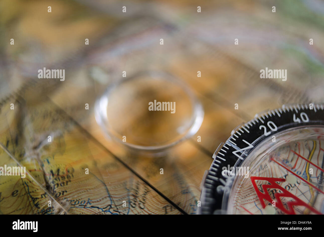 classic compass on colorful map preparing for journey with lots of ...