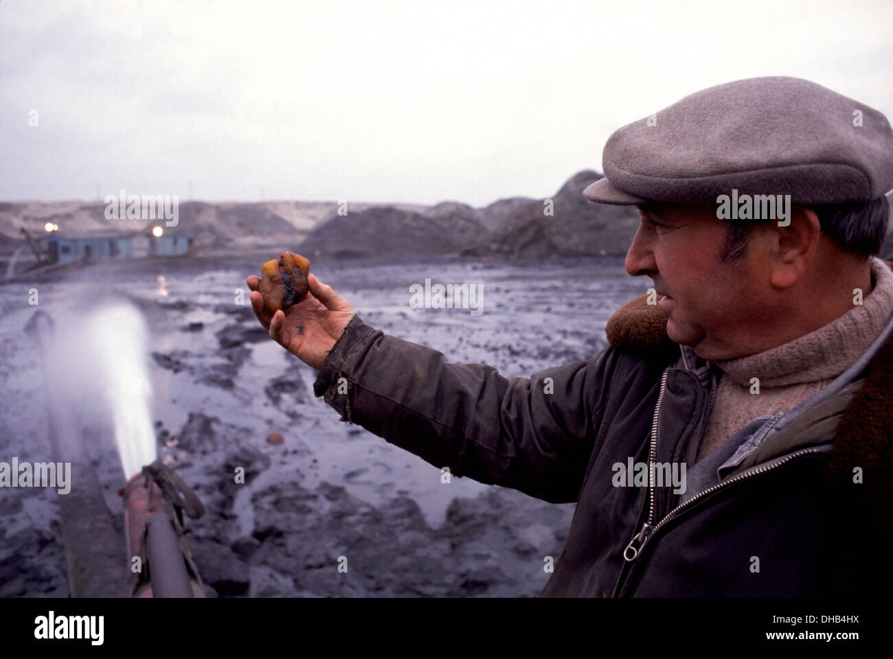 Workman holds a large amber nodule inside the Palmnicken Amber mine on ...