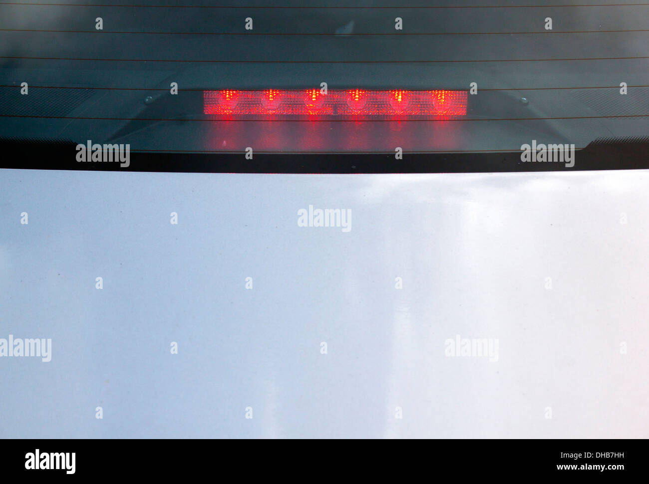 view of red LED stop light on back of automobile Stock Photo - Alamy