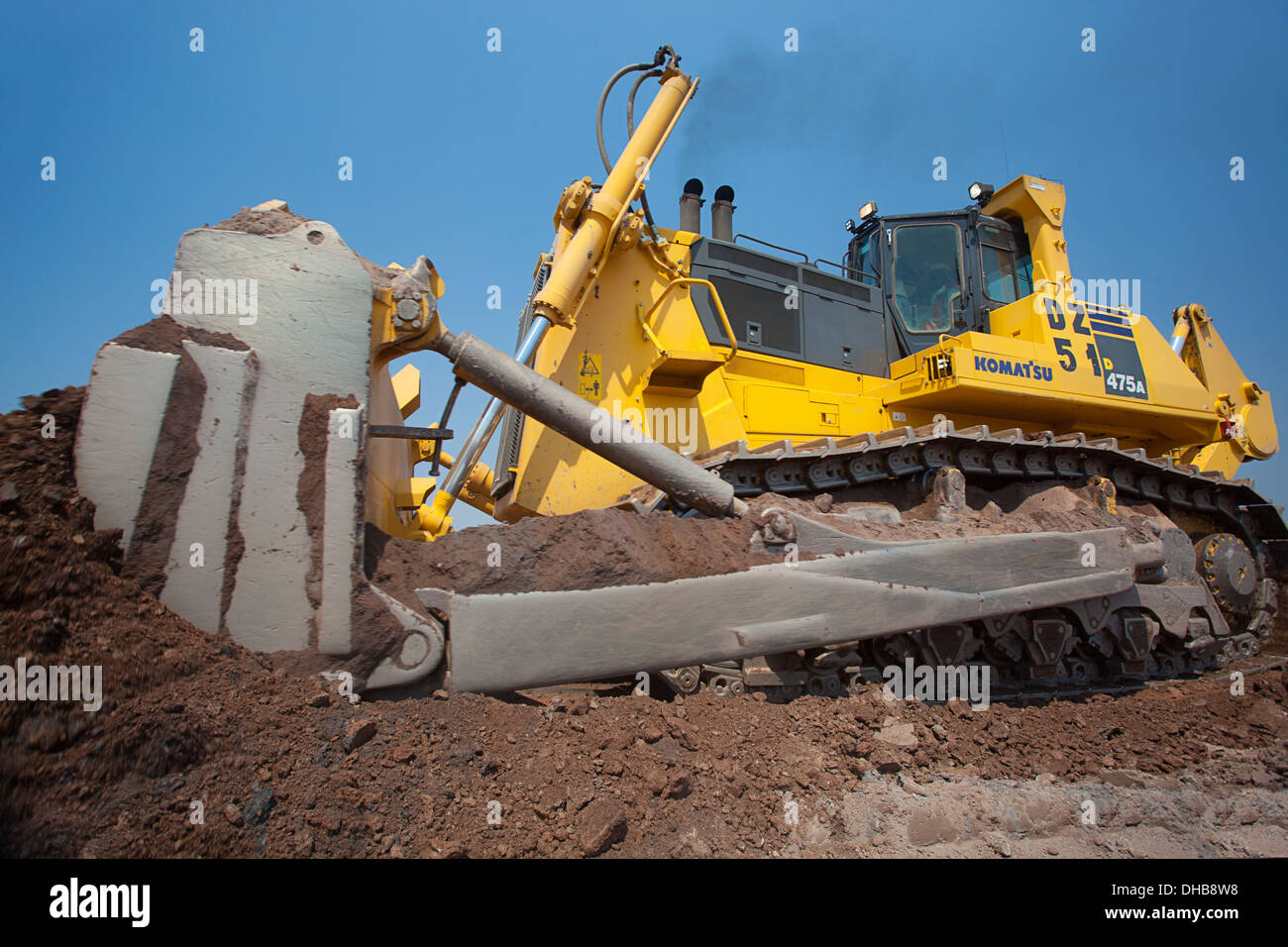 A large yellow Komatsu D475A Crawler Tractor dozer bulldozer in action ...