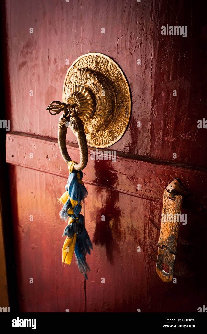 Old door at Buddhist monastery temple decorated with ancient doorknob ...