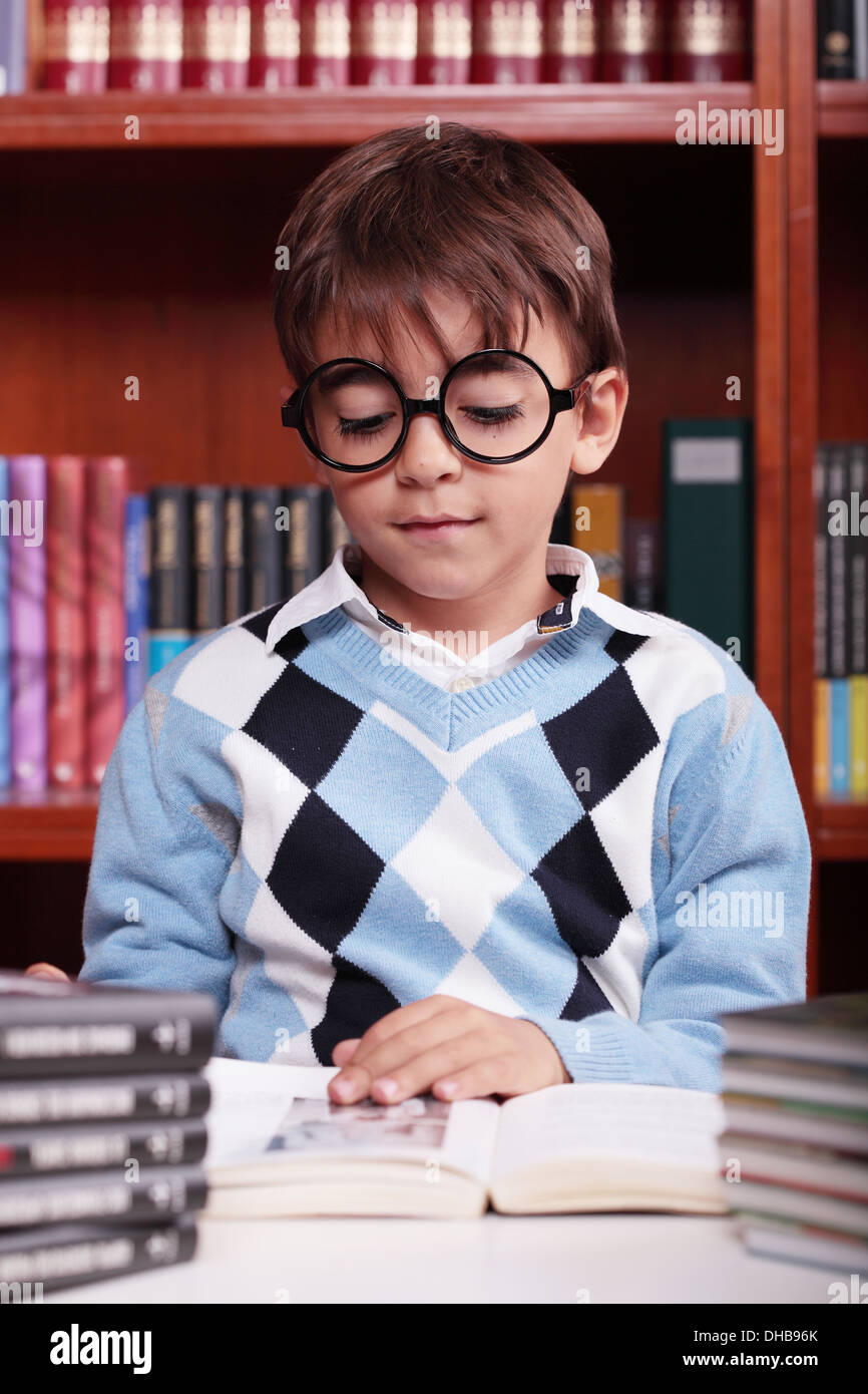 Child studying in the library Stock Photo - Alamy
