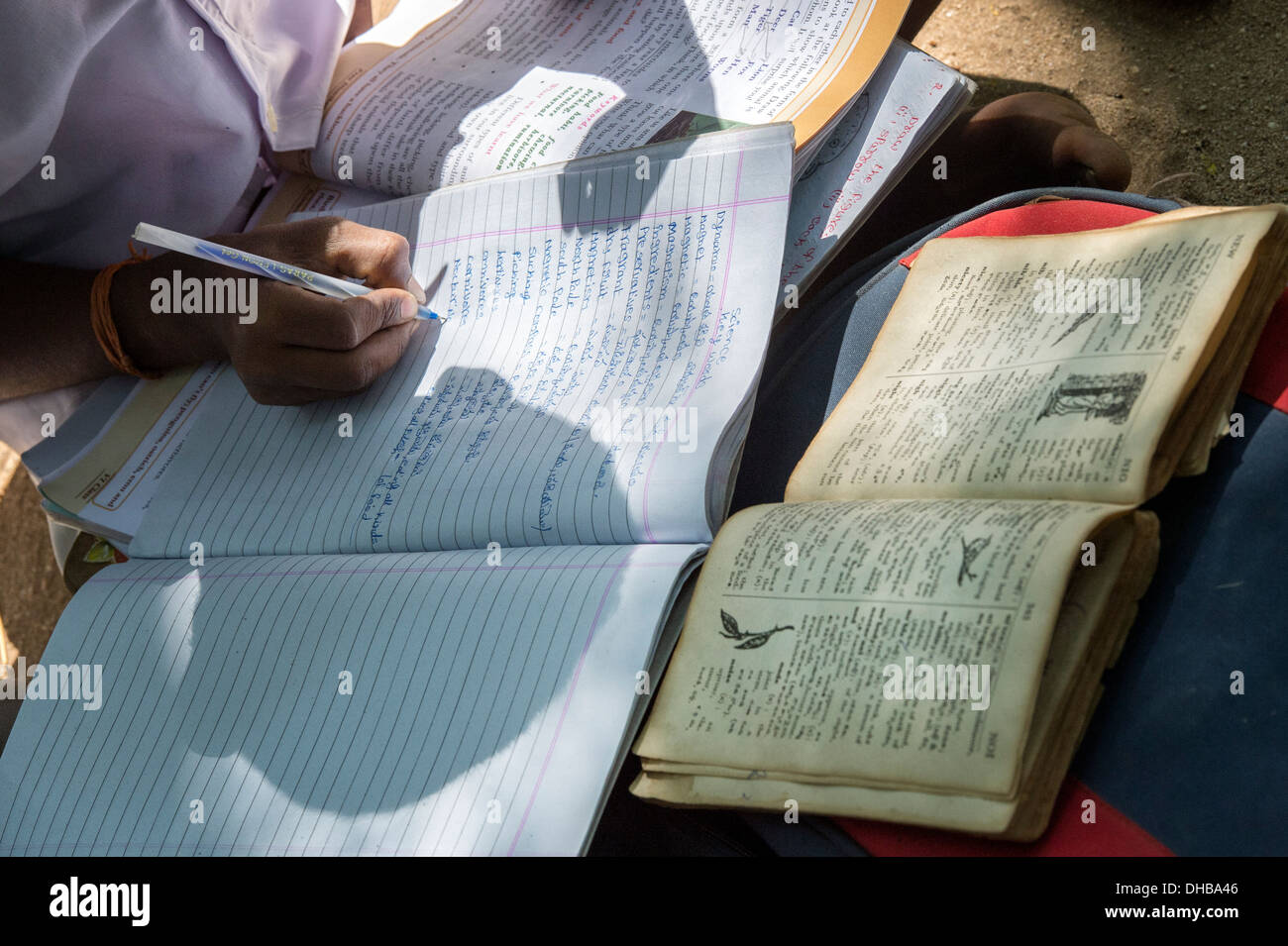 Rural Indian village high school boy writing in his school note book in ...