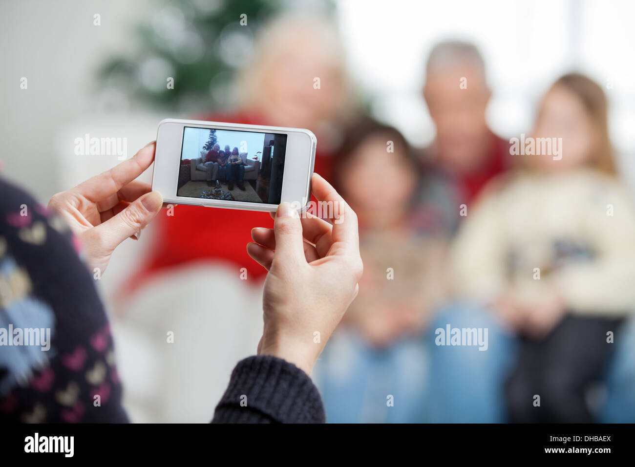 Mother Photographing Family Through Smartphone Stock Photo - Alamy