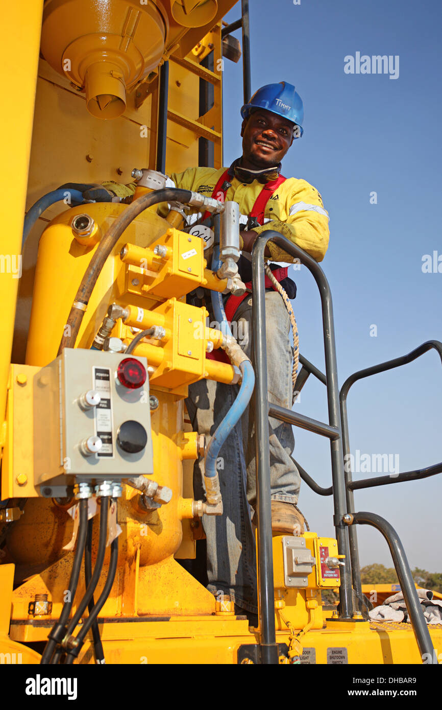 Portrait of Zambian mining employee. Hard working man with hard hat ...