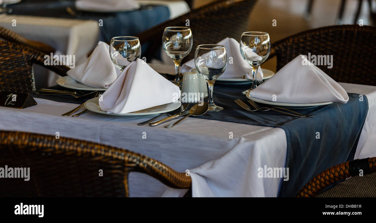 Table at restaurant served for reception of visitors Stock Photo - Alamy