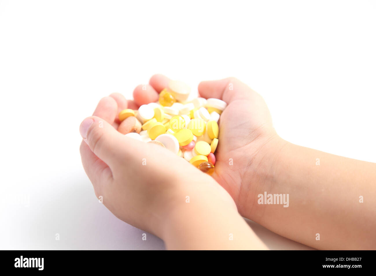 tablets in a child's hand Stock Photo - Alamy