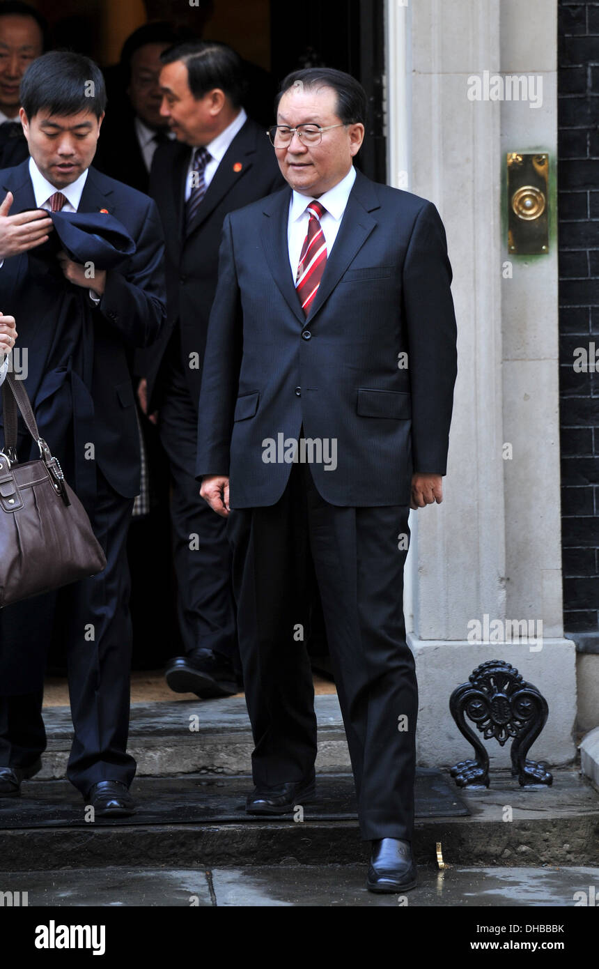 Chinese official Li Changchun (R) leaves 10 Downing street after a ...