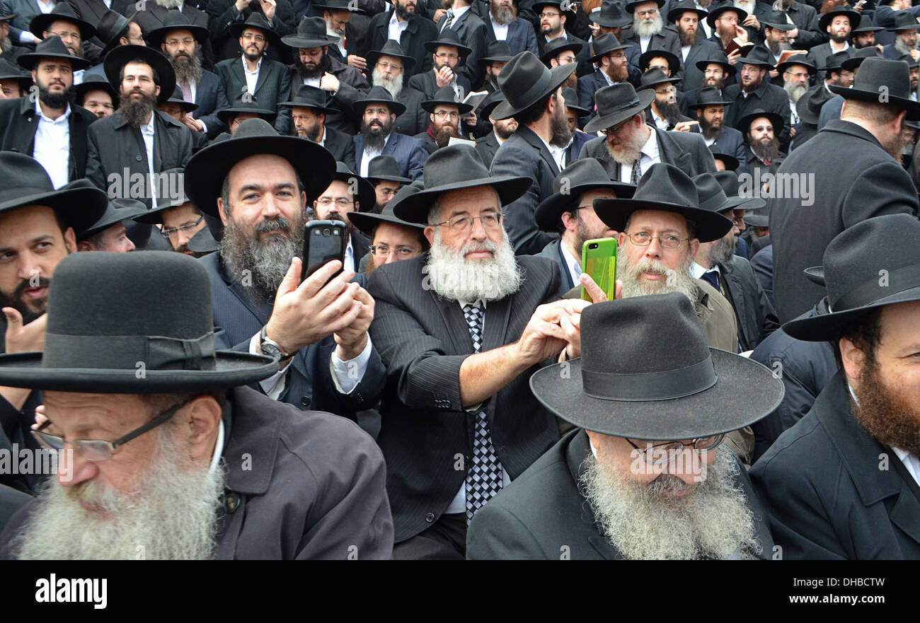 Several rabbis seated preparing for a group photo at the convention of ...