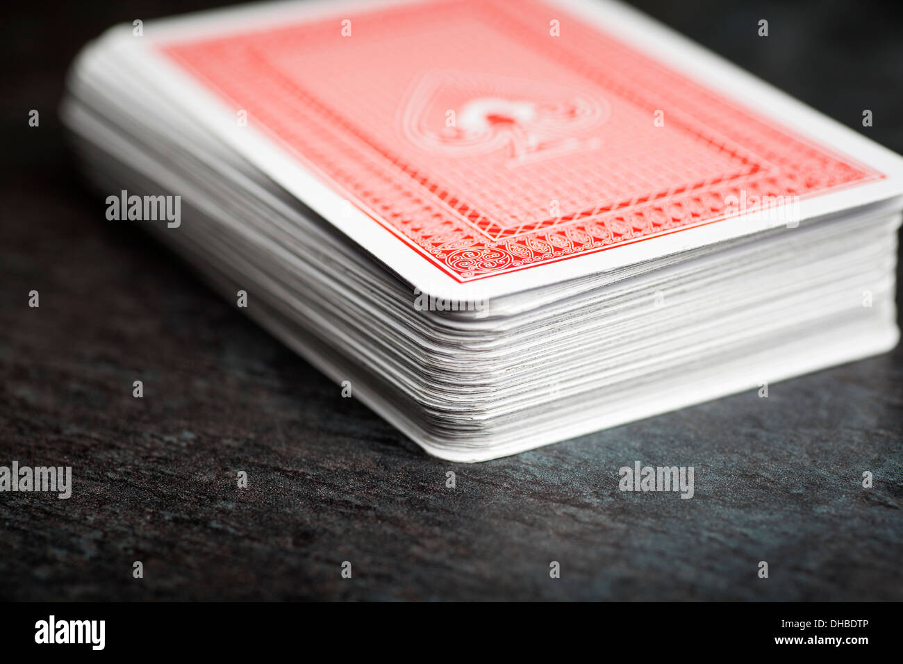 Deck of playing cards with red design Stock Photo - Alamy