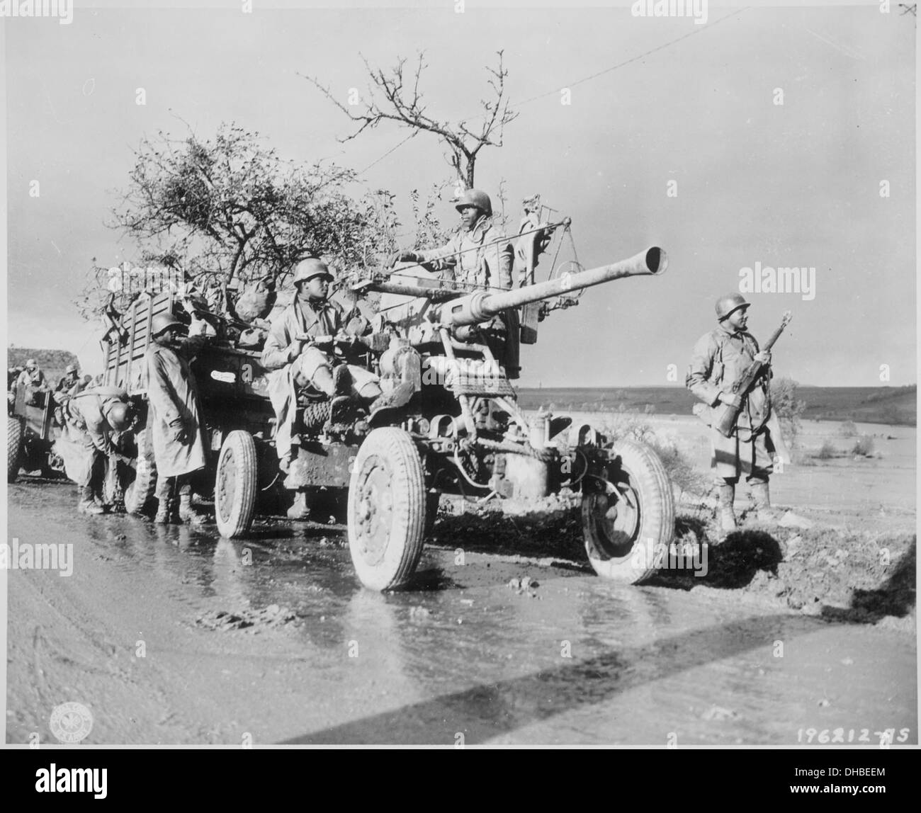 Members of Battery A, 4520 Anti-Aircraft Artillery (AA), stand by and ...