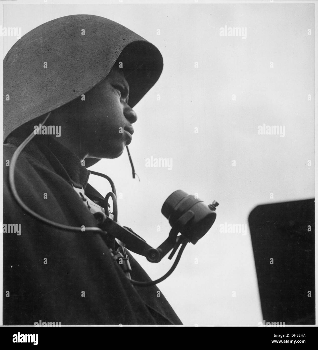 Photograph of Richard Salter, CK 3-c, operating a gun station aboard ...