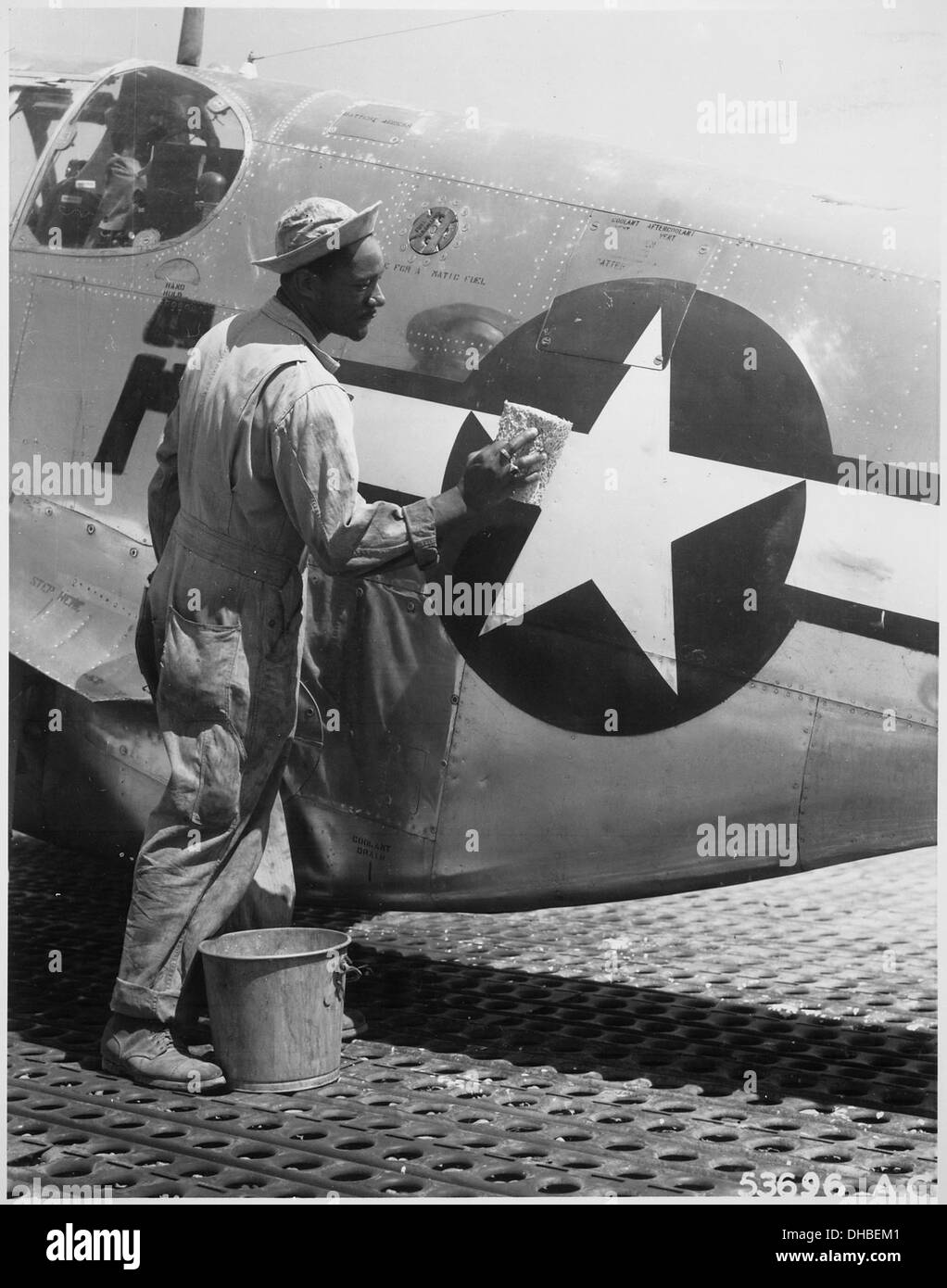 This photograph shows Staff Sergeant William Accoo, a crew chief in a ...
