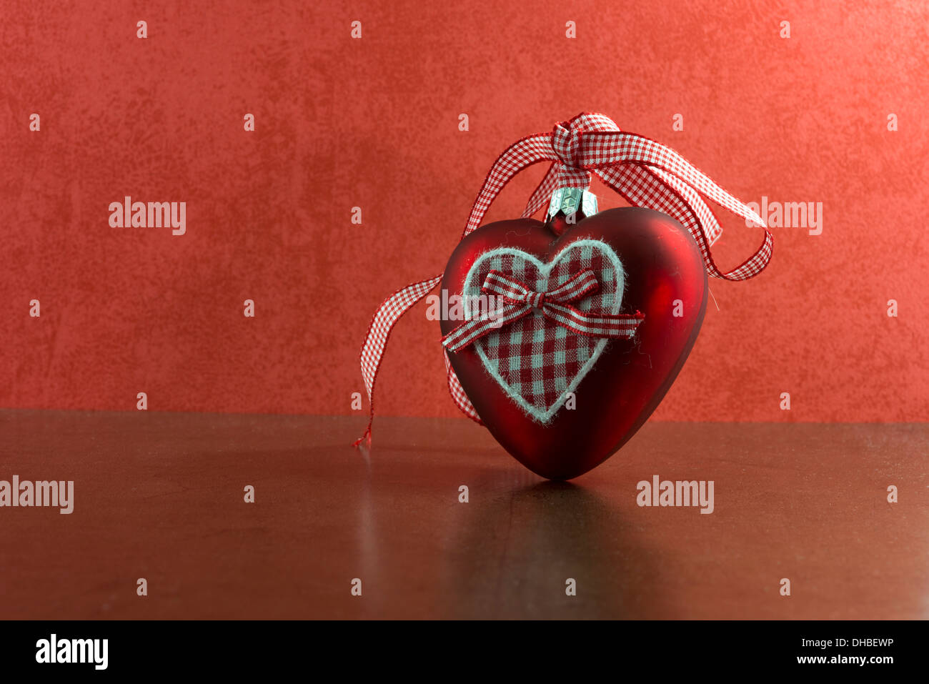red christmas heart on red and golden background Stock Photo - Alamy