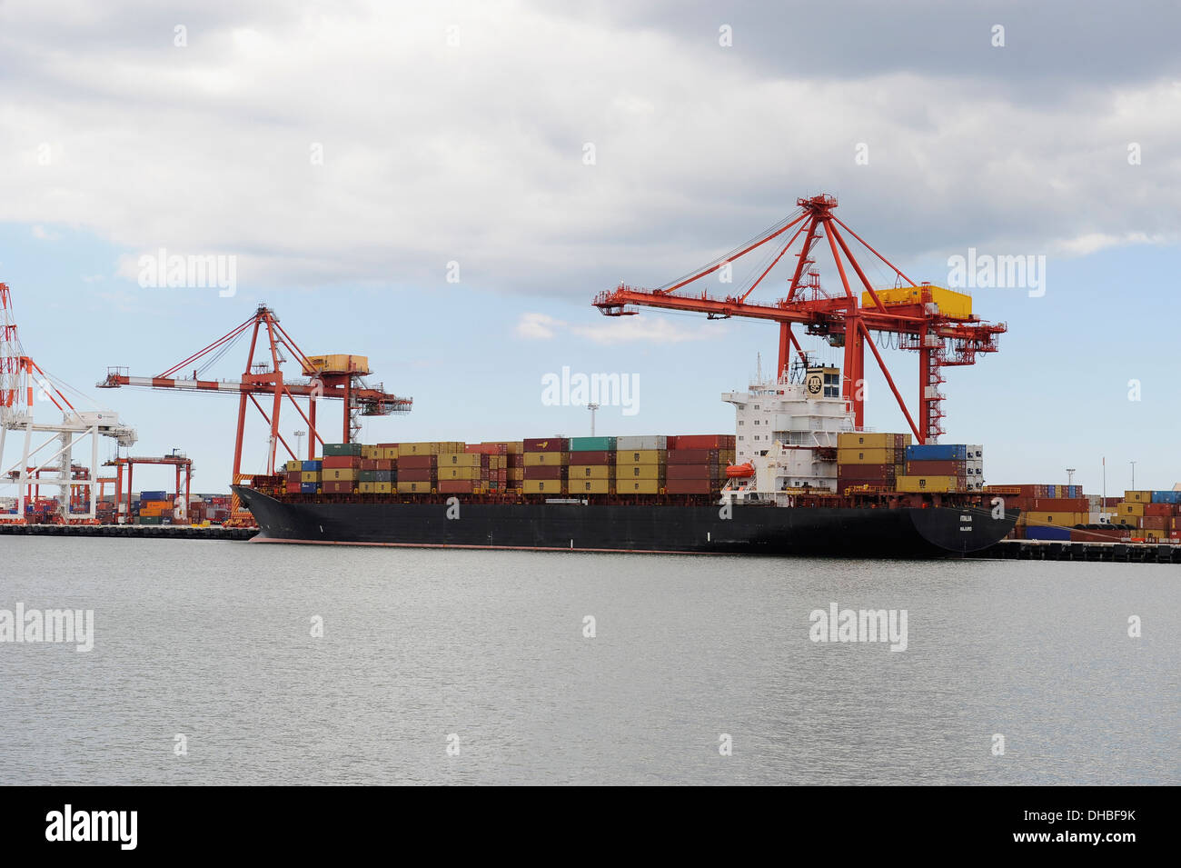 A container ship at the quayside with cranes in Fremantle, Perth ...