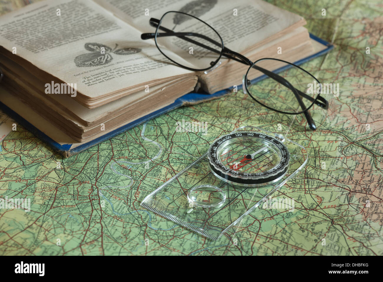classic compass on colorful map preparing for journey with lots of ...