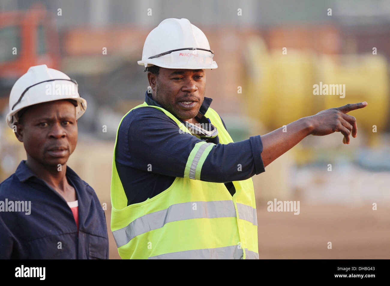 Mining in Africa. Portrait of two men employed by BIA and Komatsu Stock ...