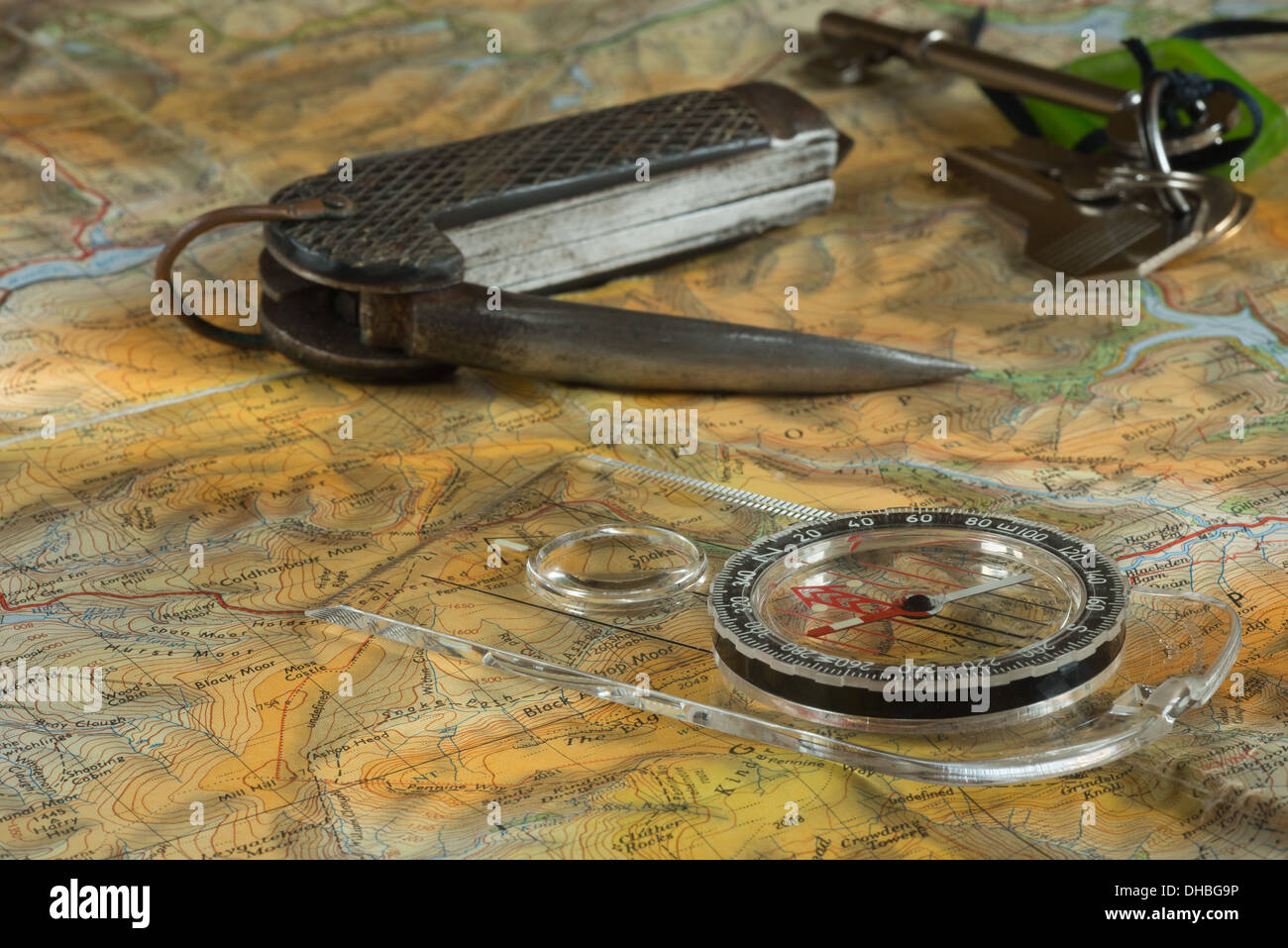 classic compass on colorful map preparing for journey with lots of ...