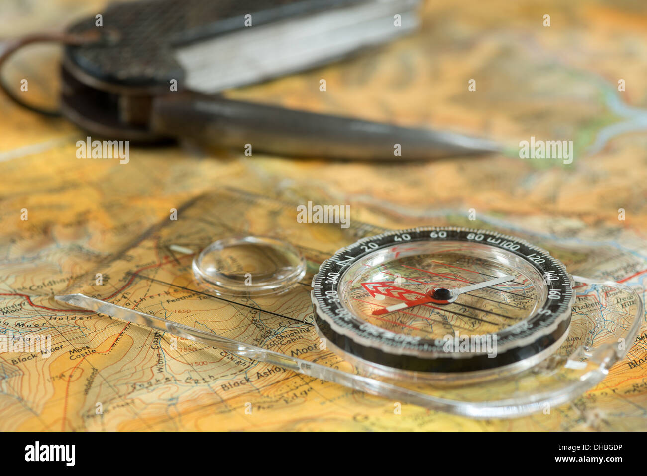 classic compass on colorful map preparing for journey with lots of ...