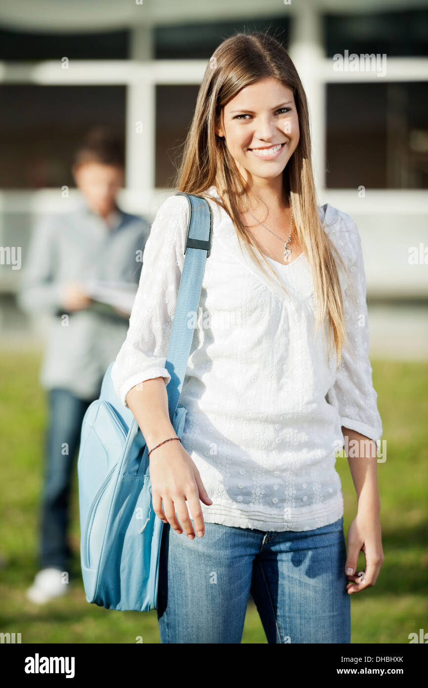University Student Carrying Shoulder Bag Standing On Campus Stock Photo ...