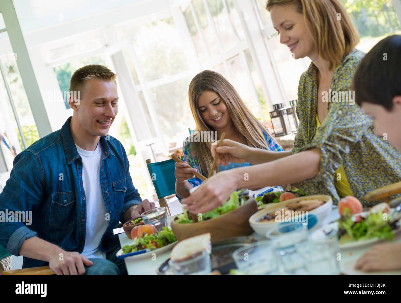 A family party around a table in a cafe. Adults and children Stock ...