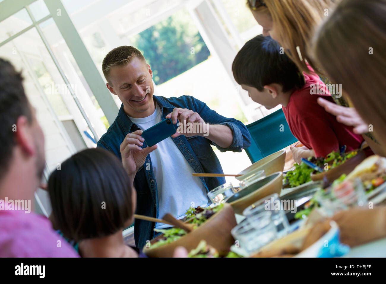 Adults Children Around Table In Stock Photos & Adults Children Around ...