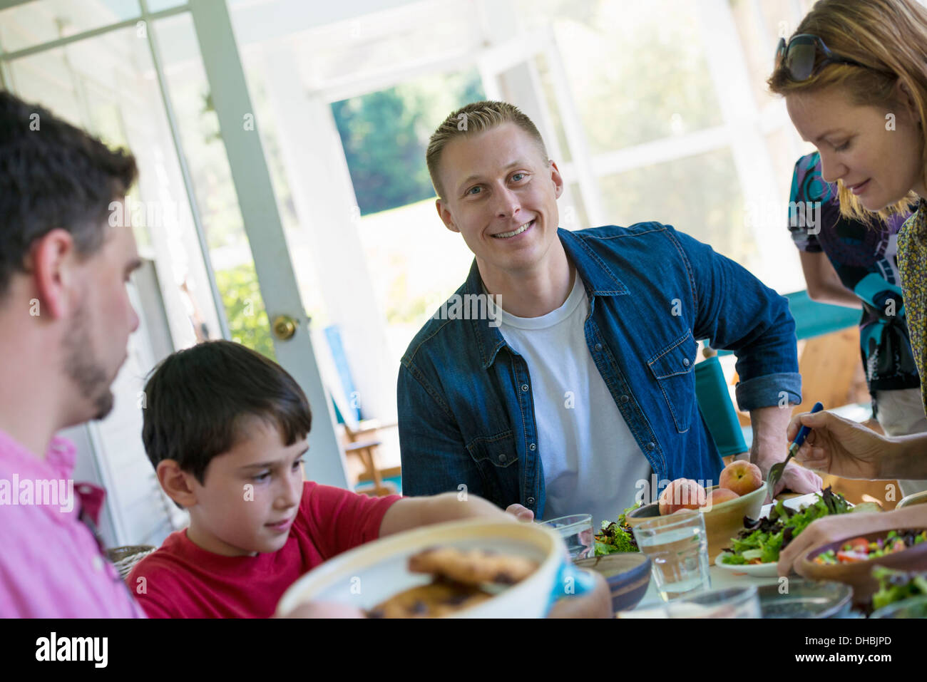 A family party around a table in a cafe. Adults and children Stock ...