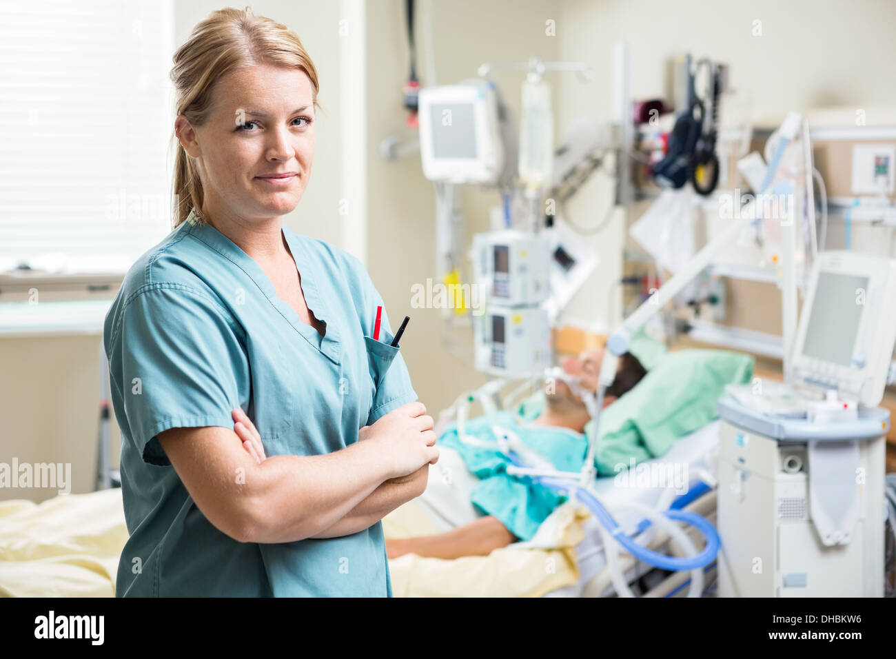 Confident Nurse With Patient Resting In Hospital Stock Photo - Alamy