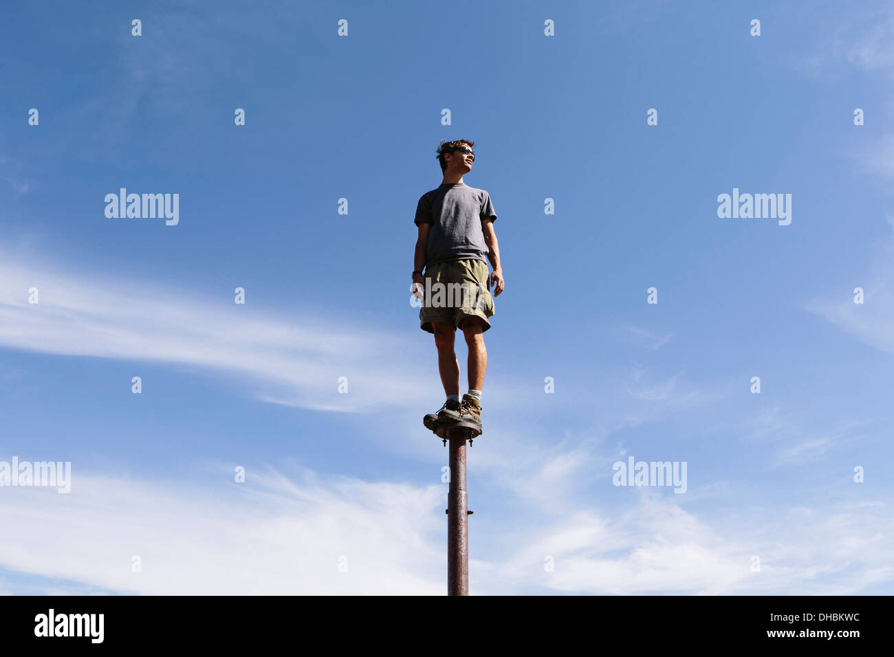 Balancing on top of pole High Resolution Stock Photography and Images ...
