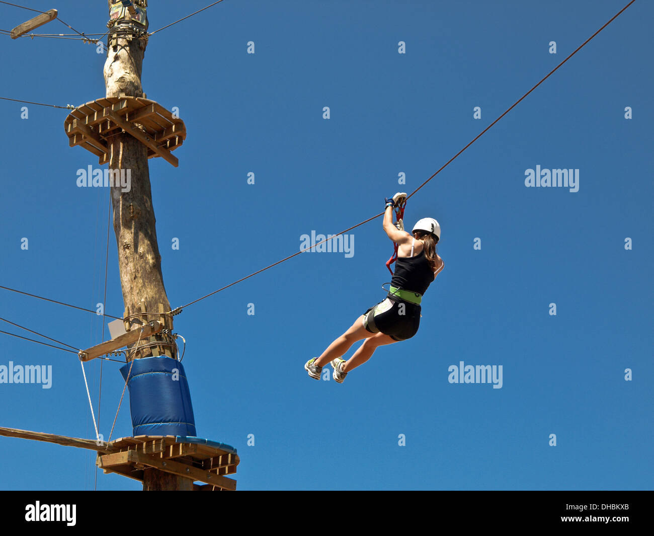 young girl sliding in adventure park Stock Photo - Alamy