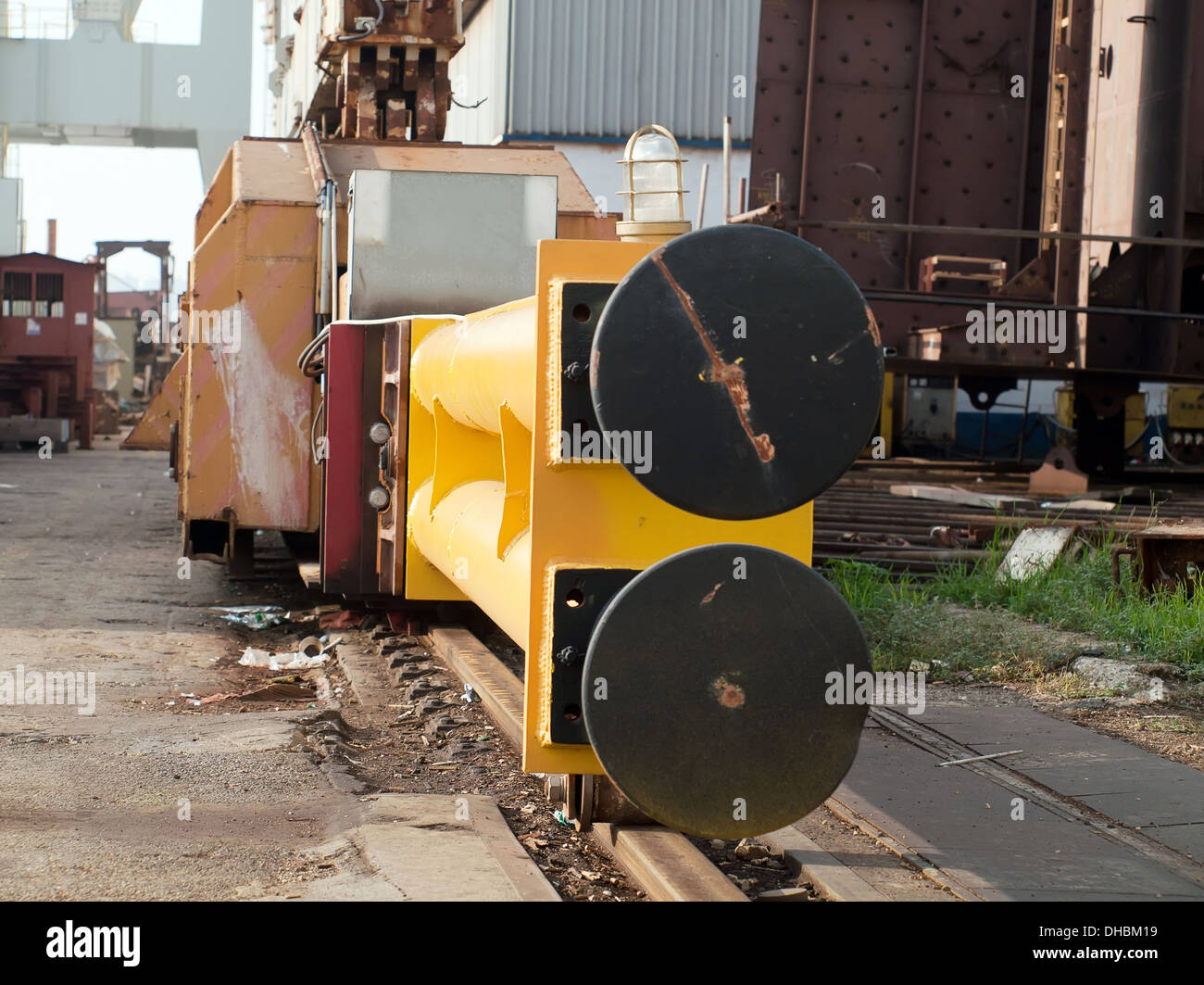 two black bumpers on shipyard crane Stock Photo - Alamy