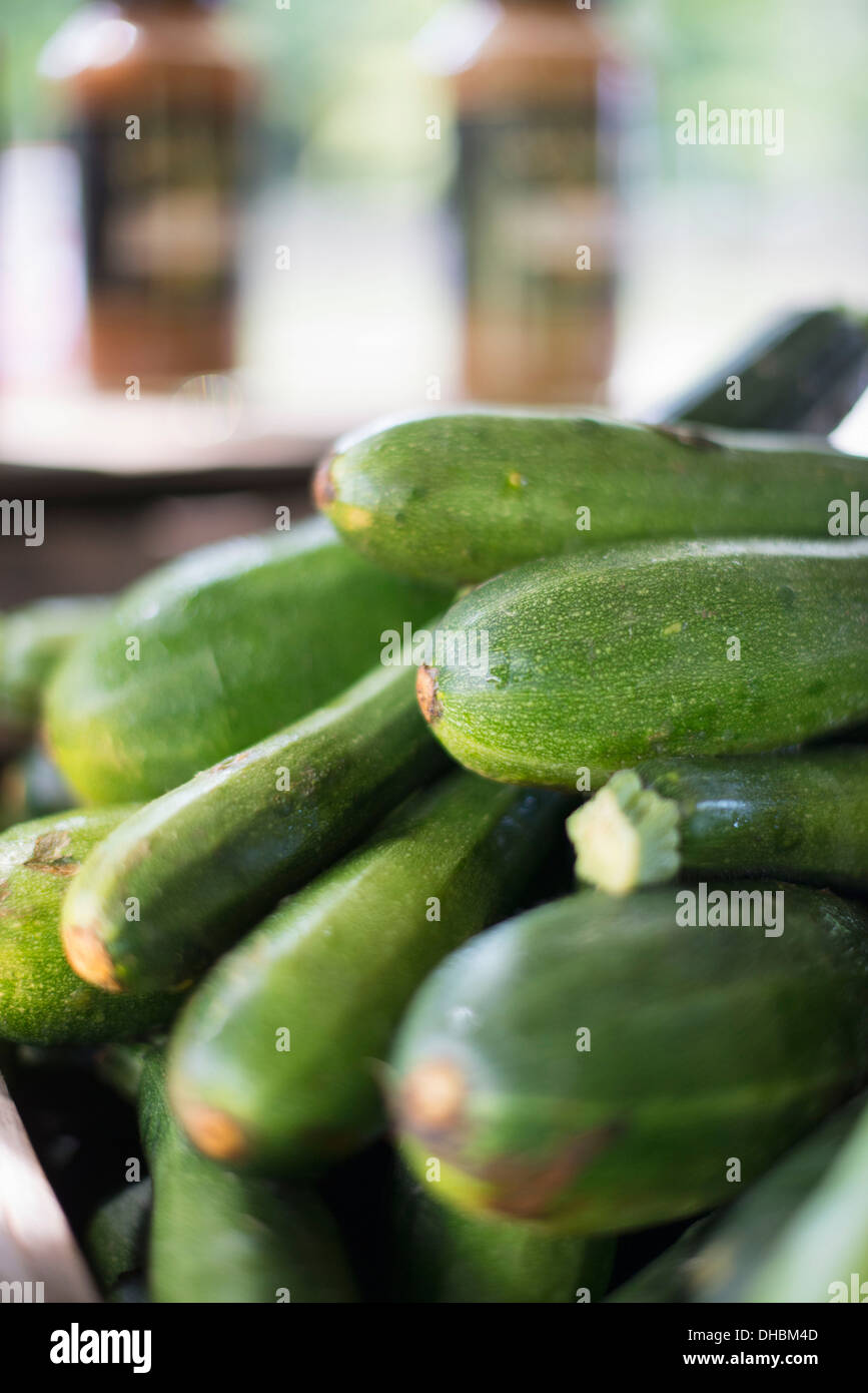 Organic vegetables on a farm stand. Piles of fresh courgettes Stock ...