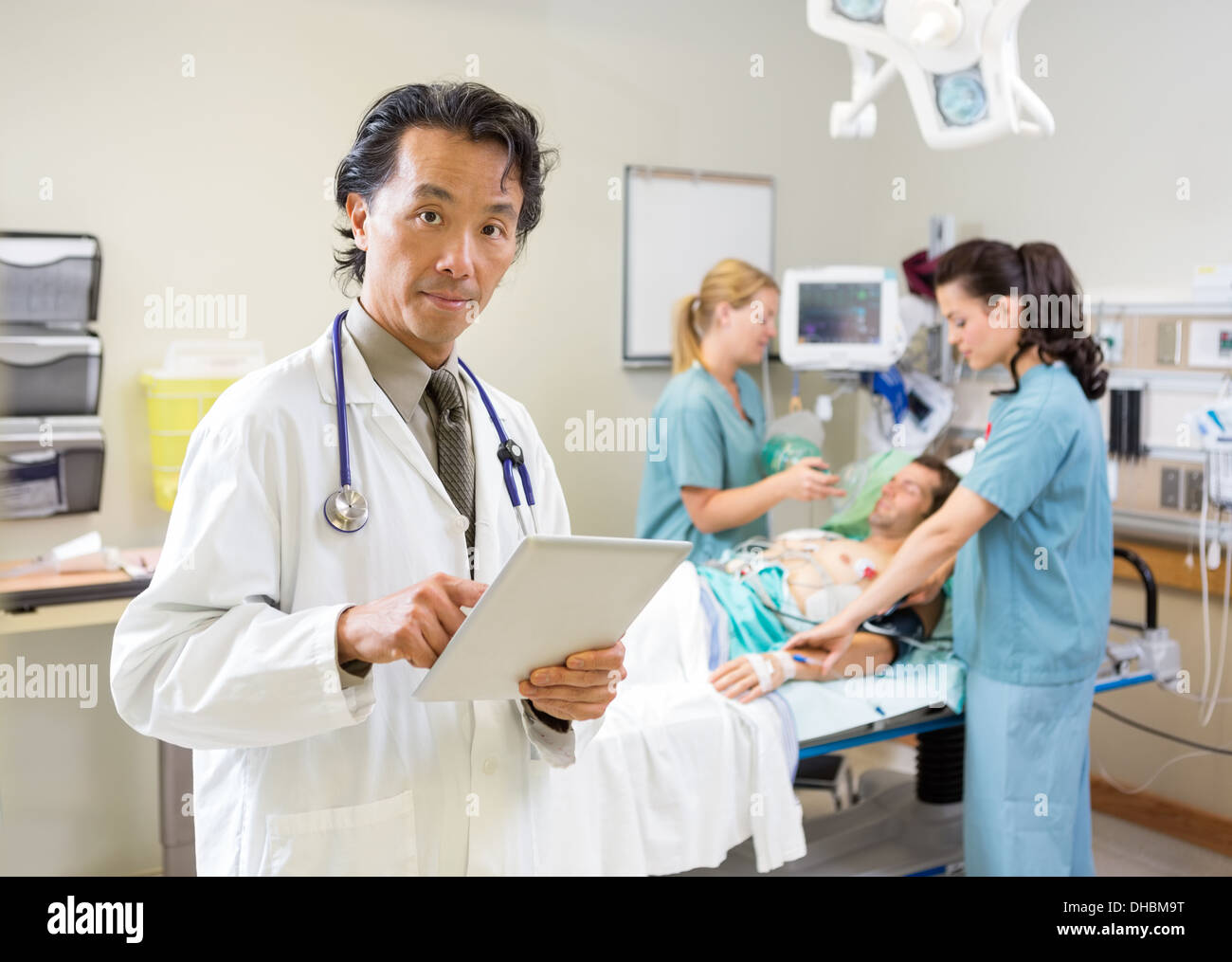 Doctor treating colleague hi-res stock photography and images - Alamy