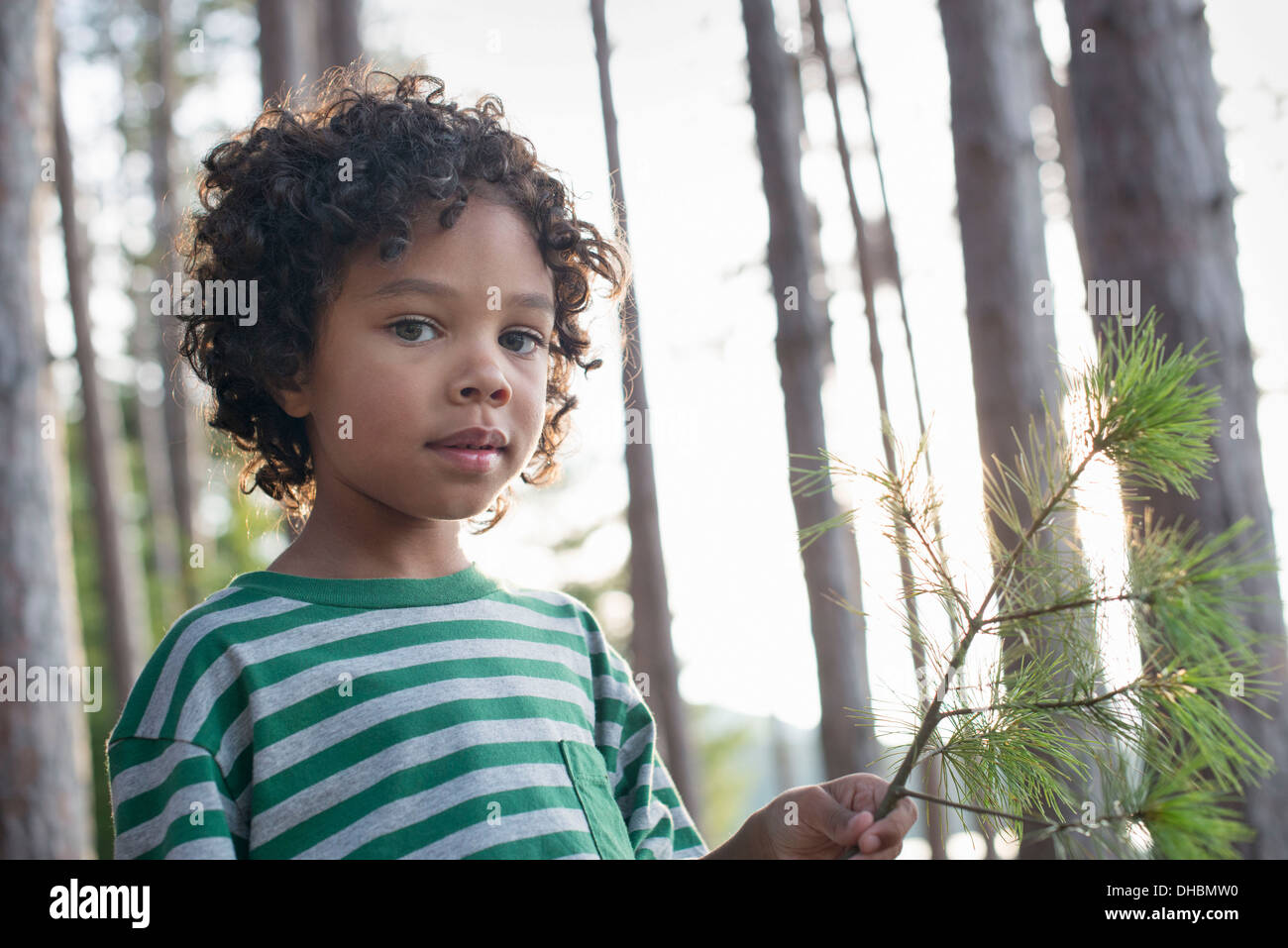 Child standing front of tree hi-res stock photography and images - Alamy
