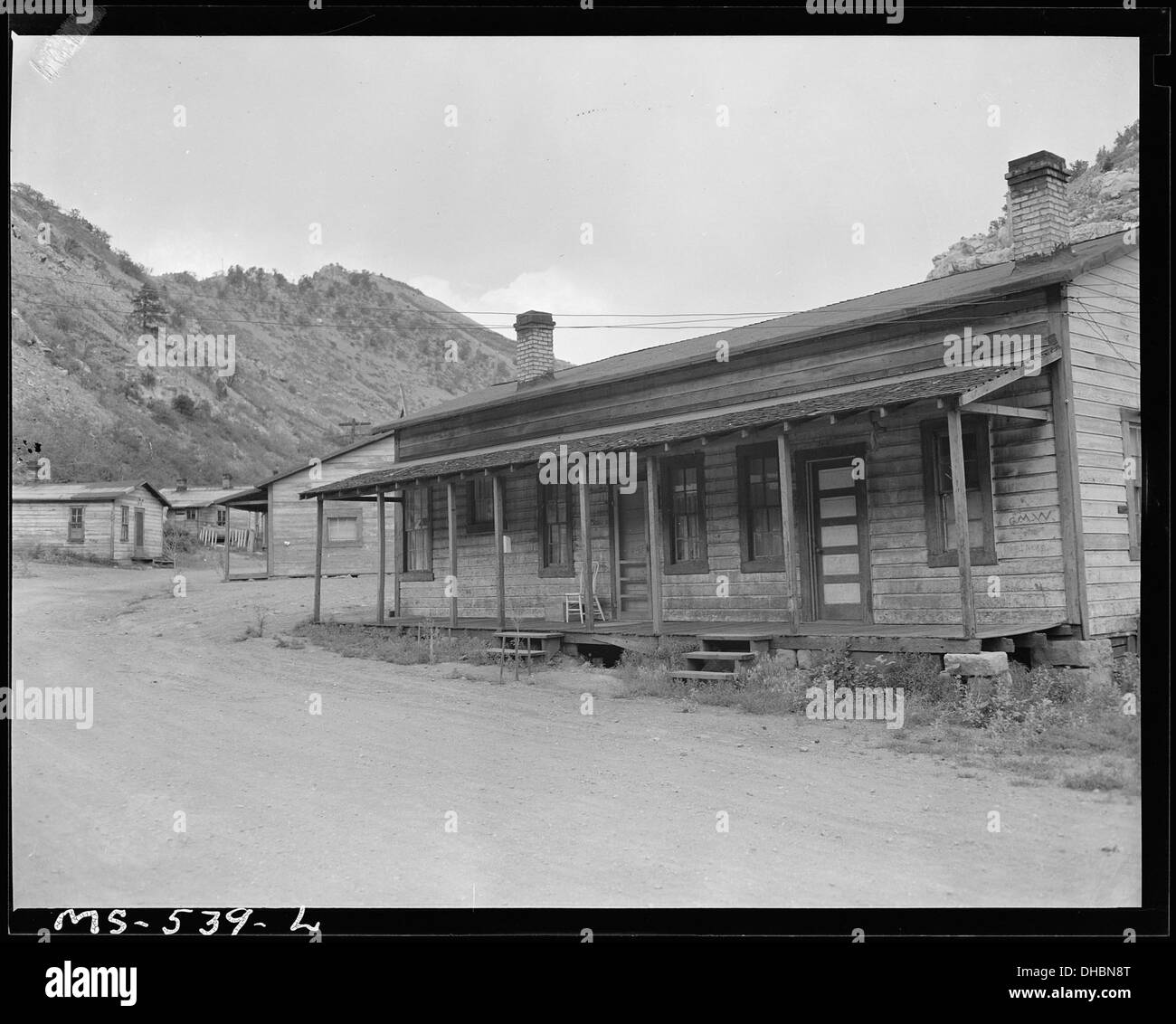 The exterior of a miner's home, with the interior shown in another ...