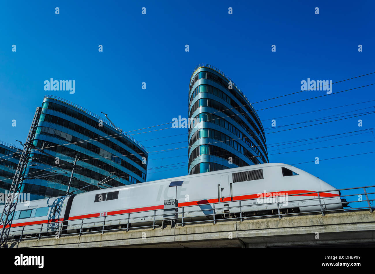 Modern high speed train with modern office buildings in Berlin, Germany ...