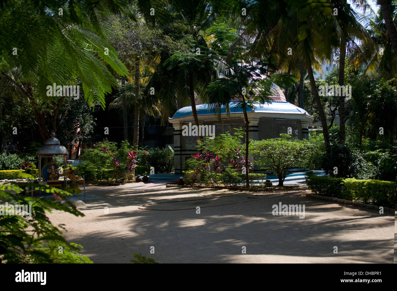 Shrine, Mausoleum, Samadhi set in sub tropical gardens in dappled ...